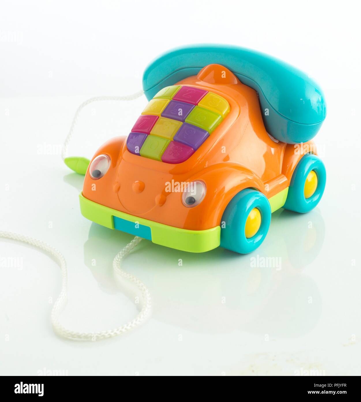 Plastic toy telephone in shape of a car with cord attached Stock Photo ...