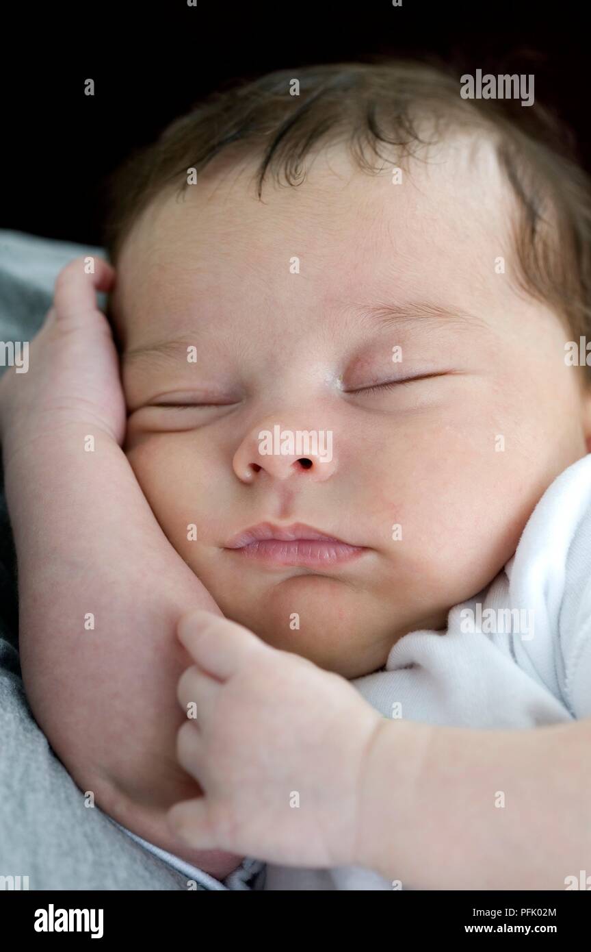 Baby boy asleep, resting head on arm, close-up Stock Photo - Alamy