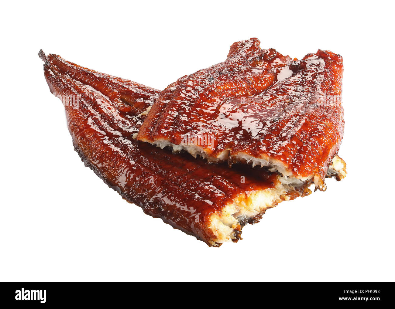two pieces of grilled unagi fillet or eel with soy sauce isolated on white background, asian ...