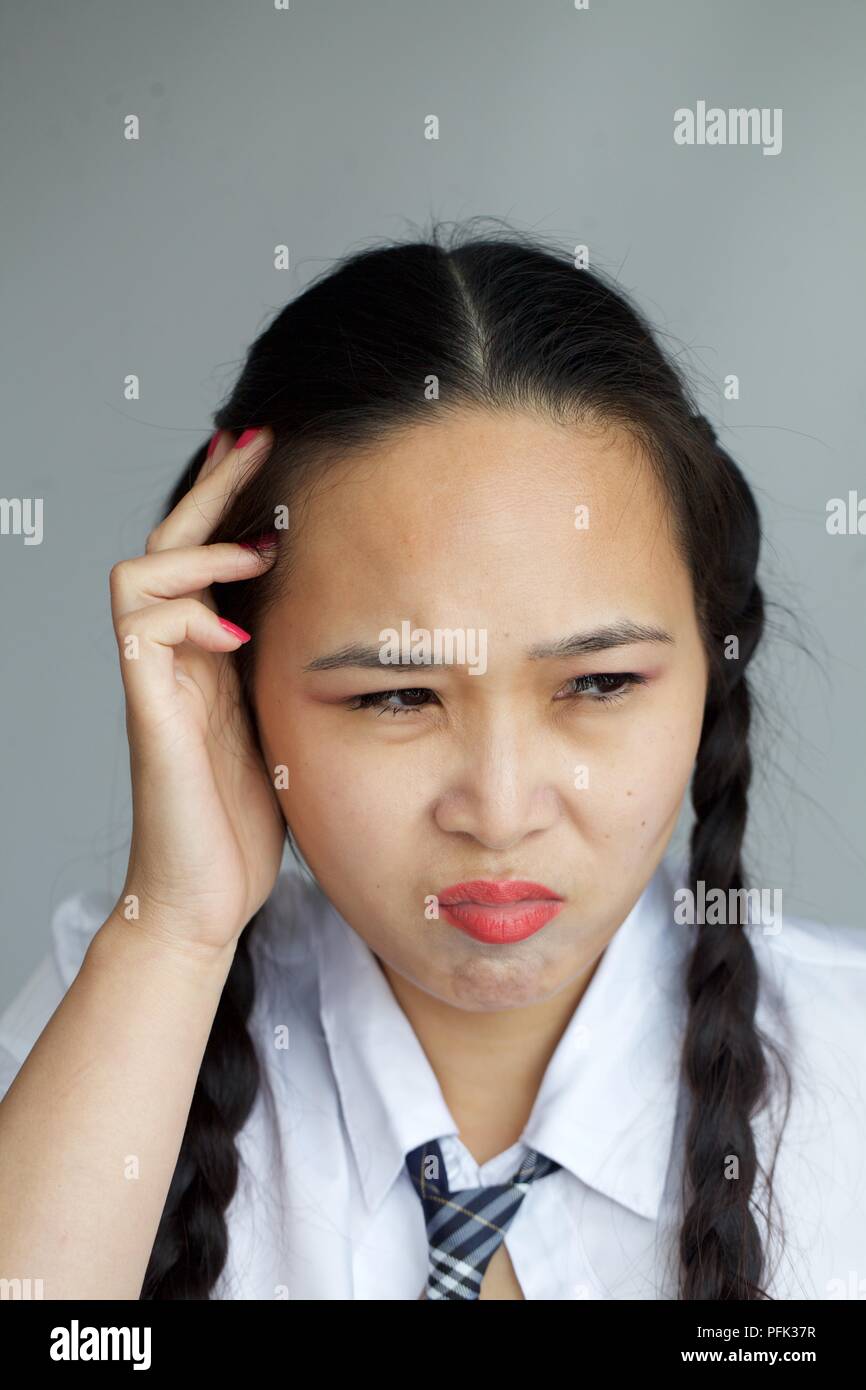 School girl perplexed about something Stock Photo - Alamy