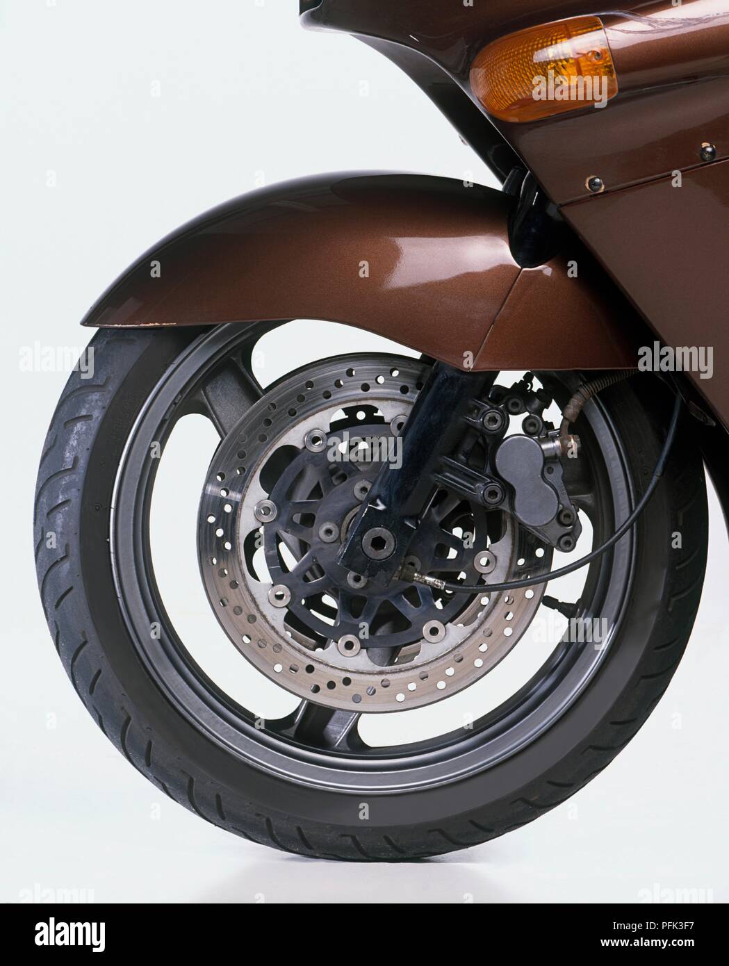 Close-up of back wheel of motorbike Stock Photo - Alamy