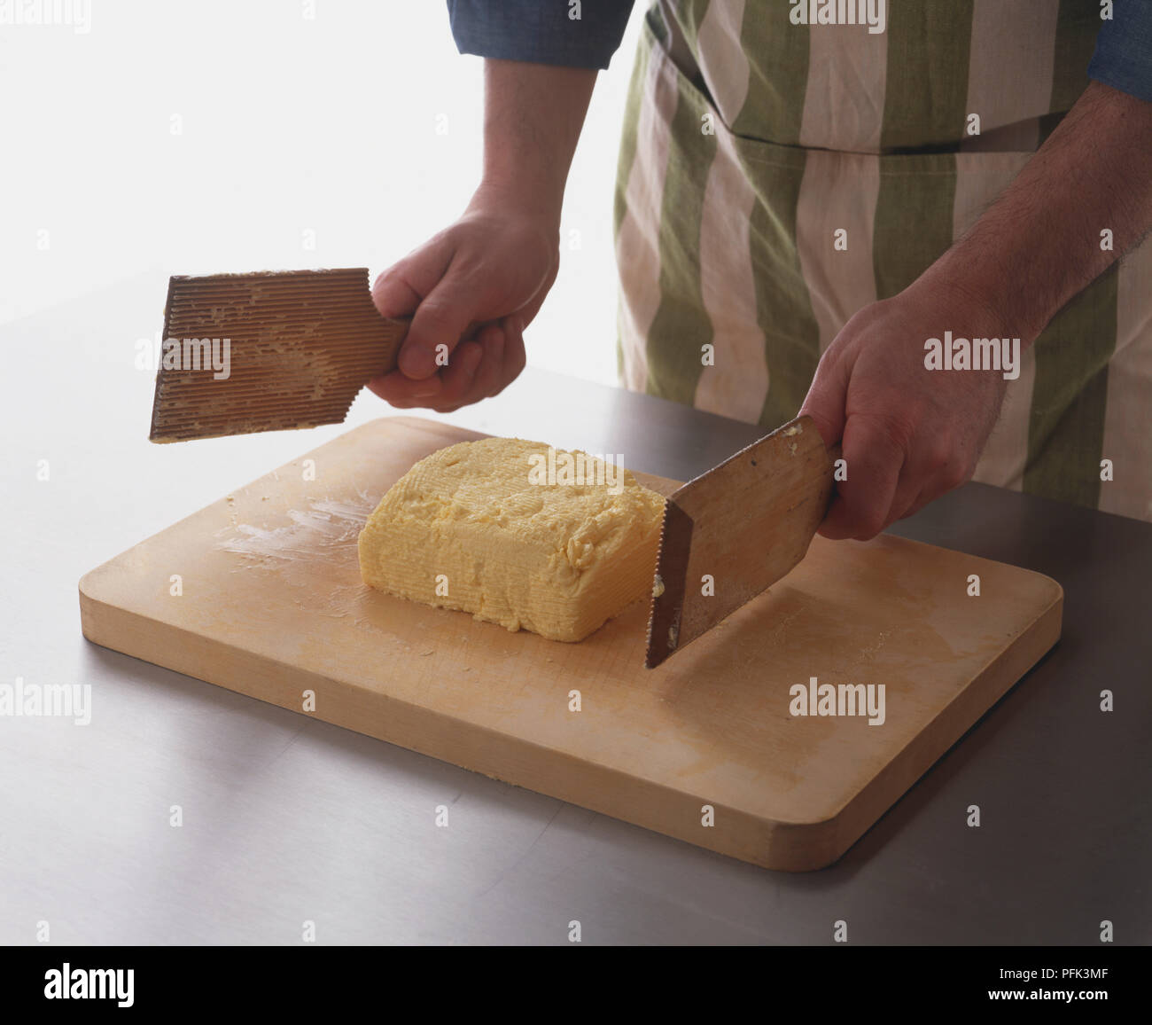 Shaping butter on board using scotch hands Stock Photo - Alamy