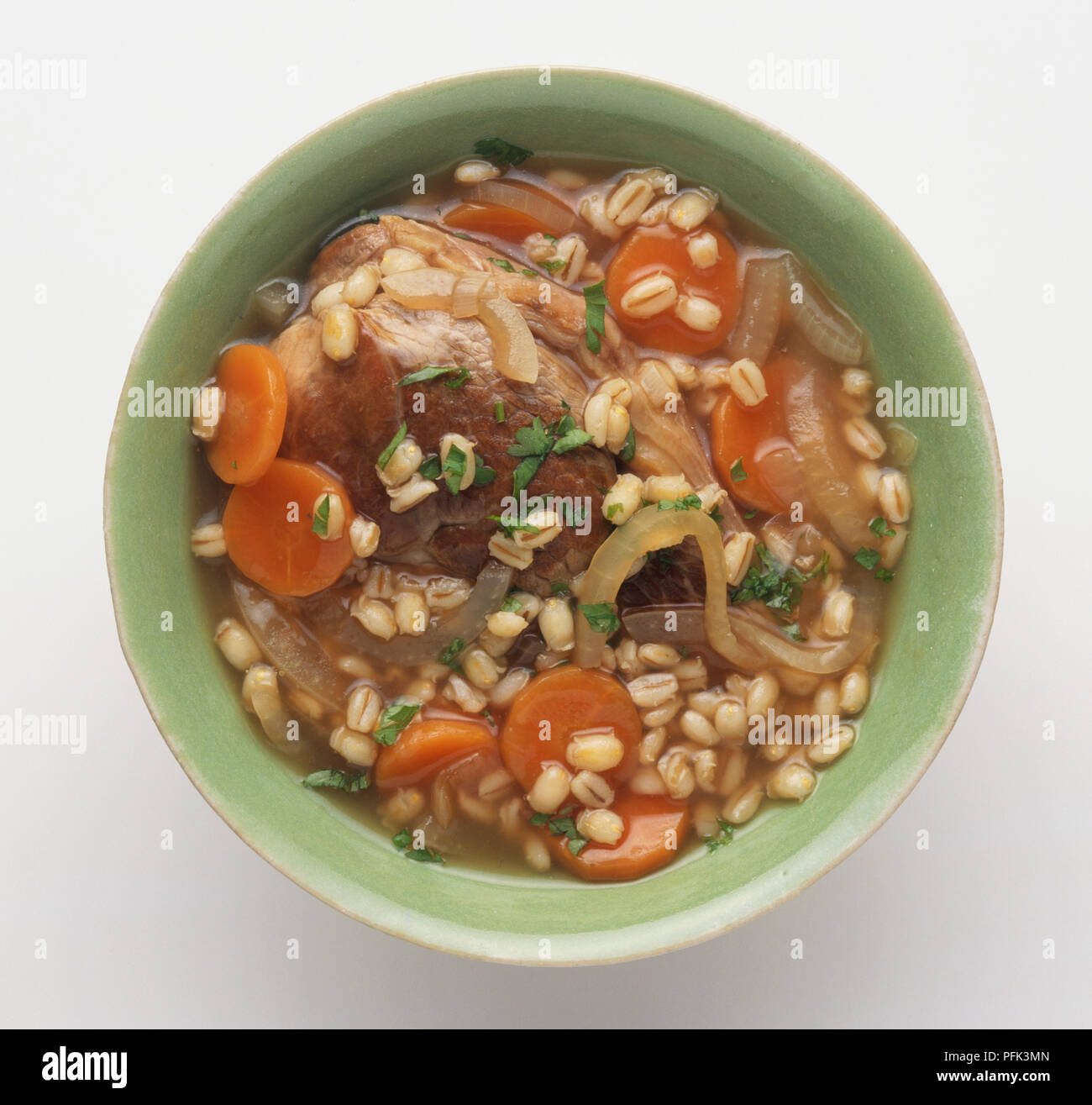 Plate of stew containing meat, vegetables and pearl barley Stock Photo ...
