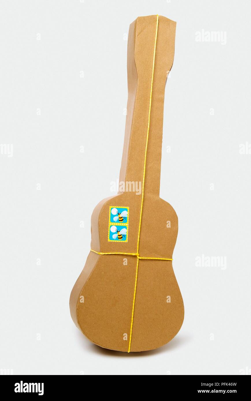 Guitar wrapped brown paper hi-res stock photography and images - Alamy