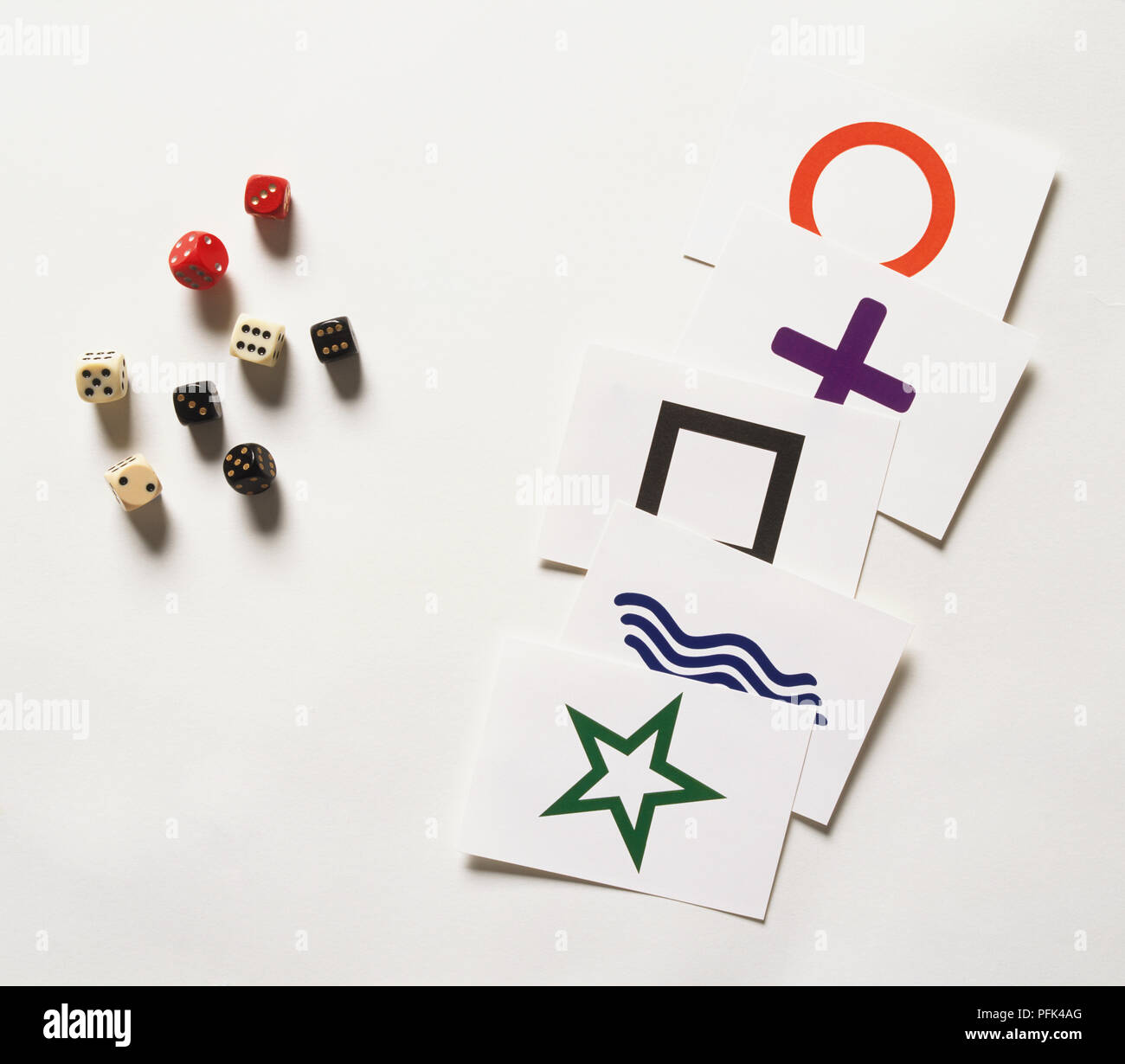A selection of red, white and black dice and different telepathy symbol ...
