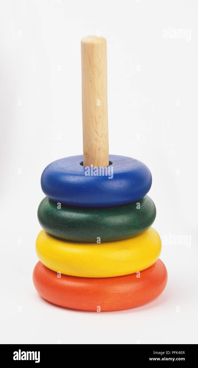 Different coloured hoops stacked on pole Stock Photo - Alamy