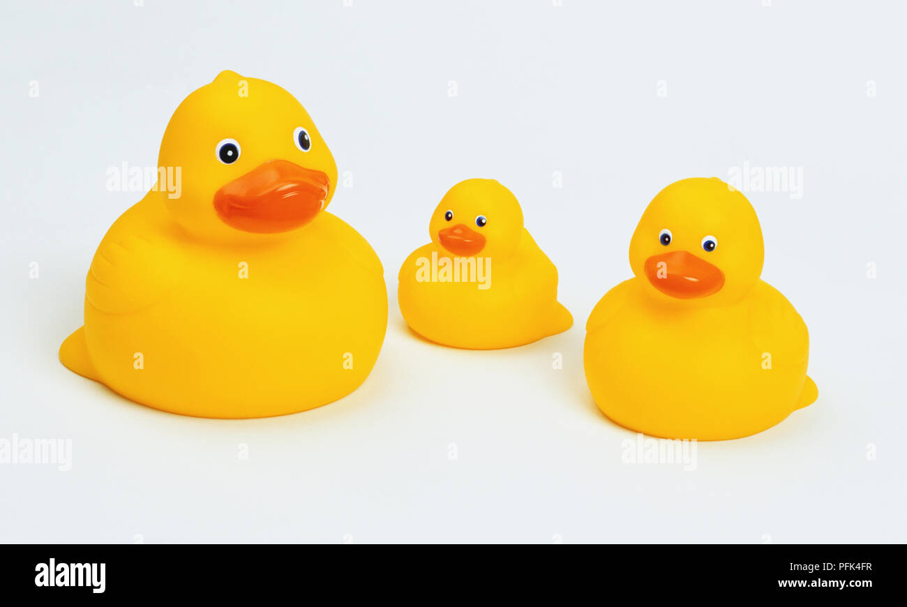 Three yellow rubber ducks Stock Photo - Alamy