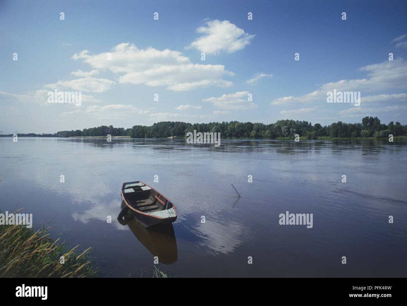 France, Loire Valley, Loire river, empty rowing boat in water Stock ...