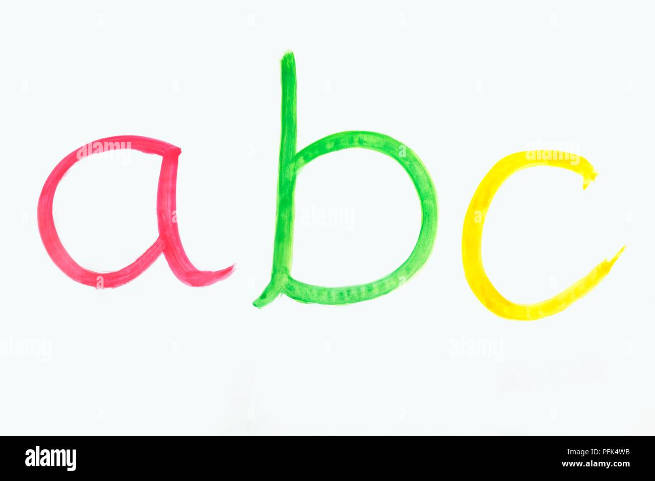 Letters, a, b and c, painted in pink, green and yellow Stock Photo - Alamy