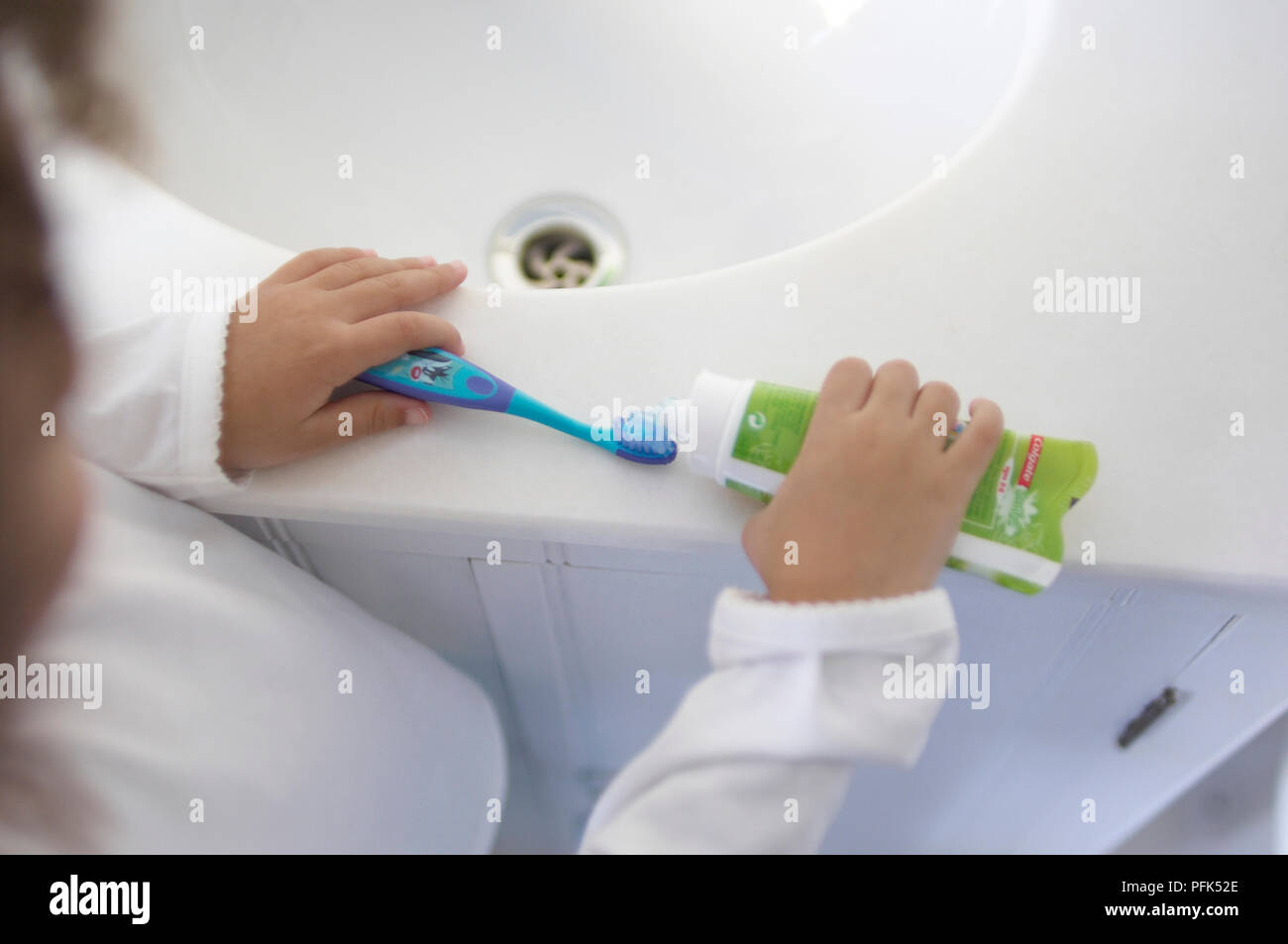 Squeezing toothpaste onto toothbrush hi-res stock photography and ...