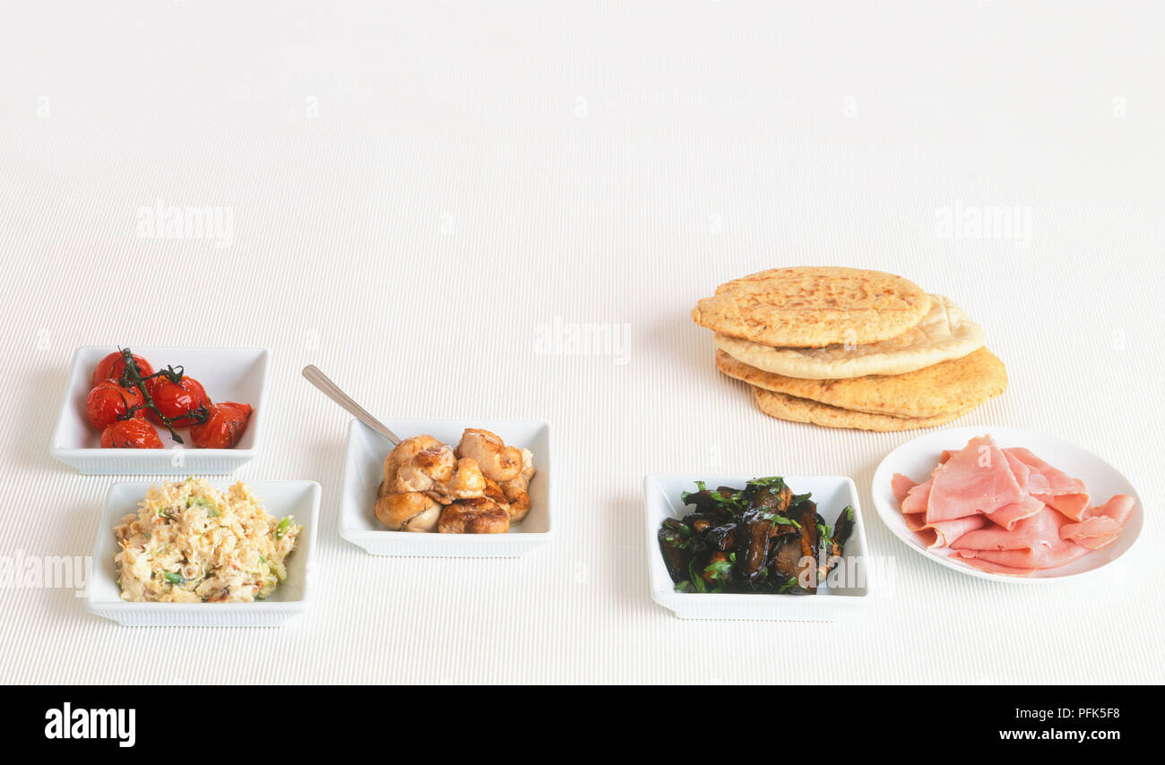 Pita bread and toppings Stock Photo - Alamy