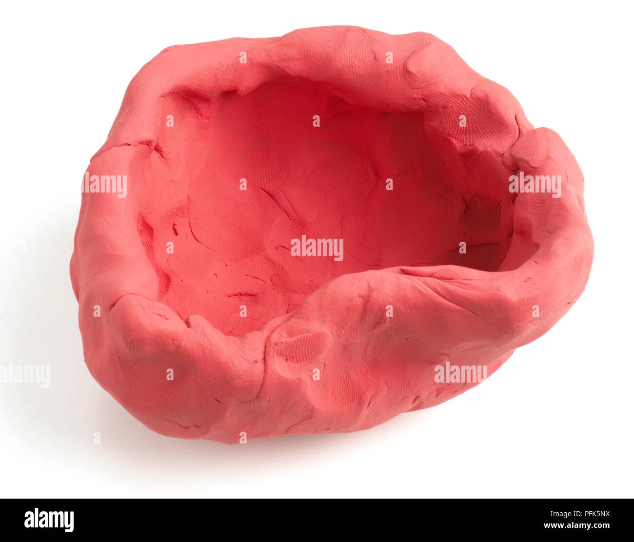 Bowl shape red modelling clay, close-up Stock Photo - Alamy
