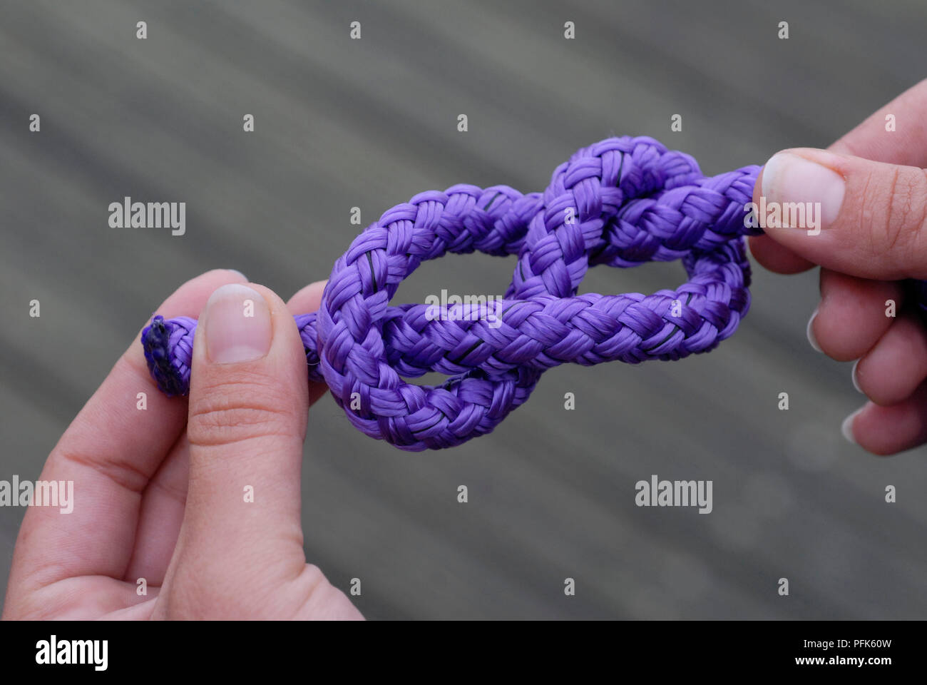 Woman holding rope knot hi-res stock photography and images - Alamy