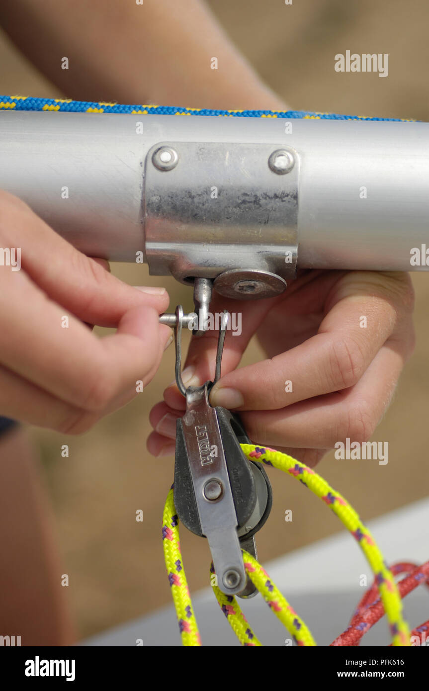 Person rigging two-handed dinghy Stock Photo - Alamy