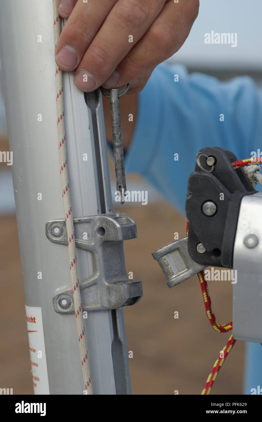 Person rigging two-handed dinghy Stock Photo - Alamy