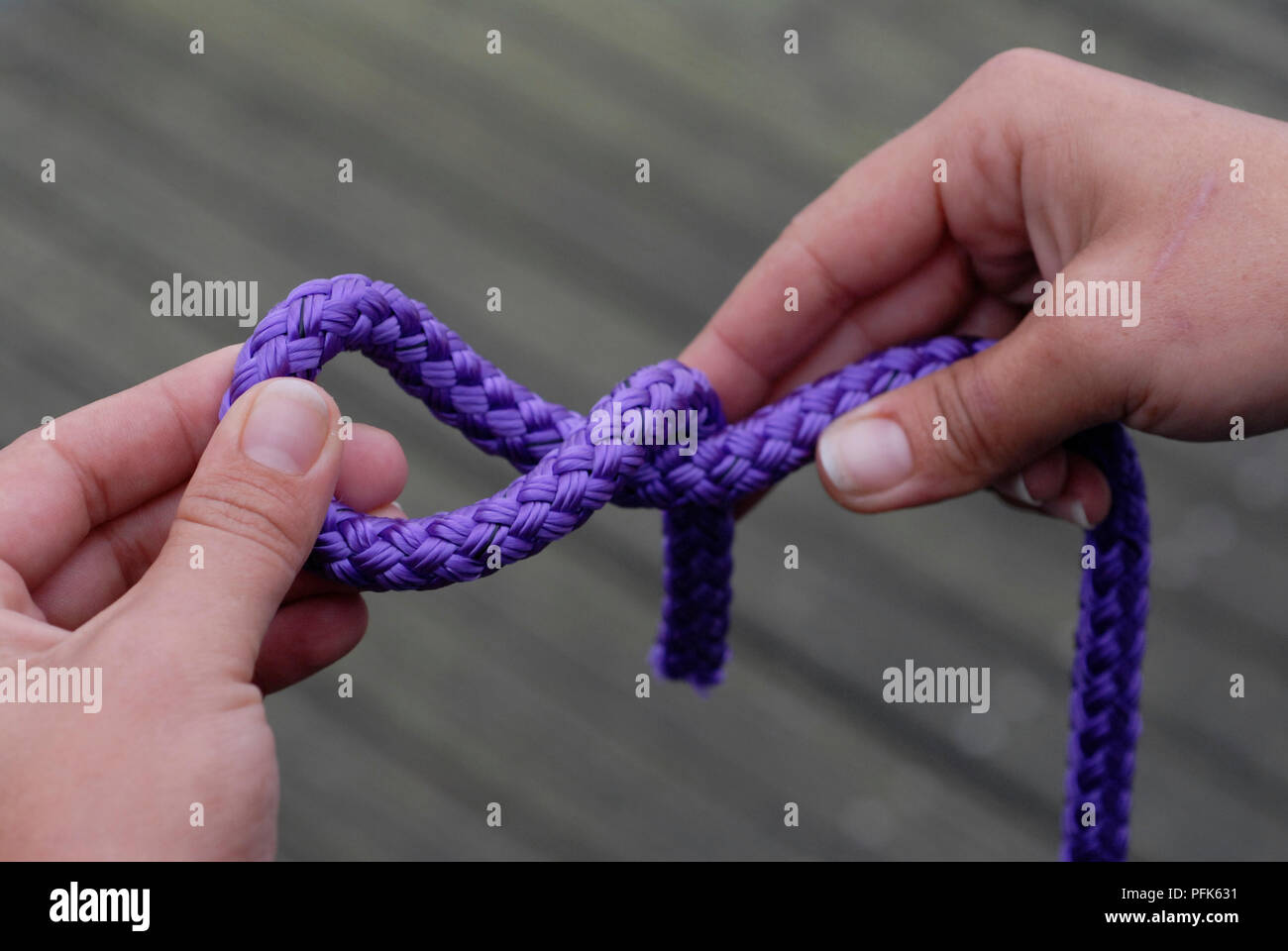 Woman holding rope knot hi-res stock photography and images - Alamy
