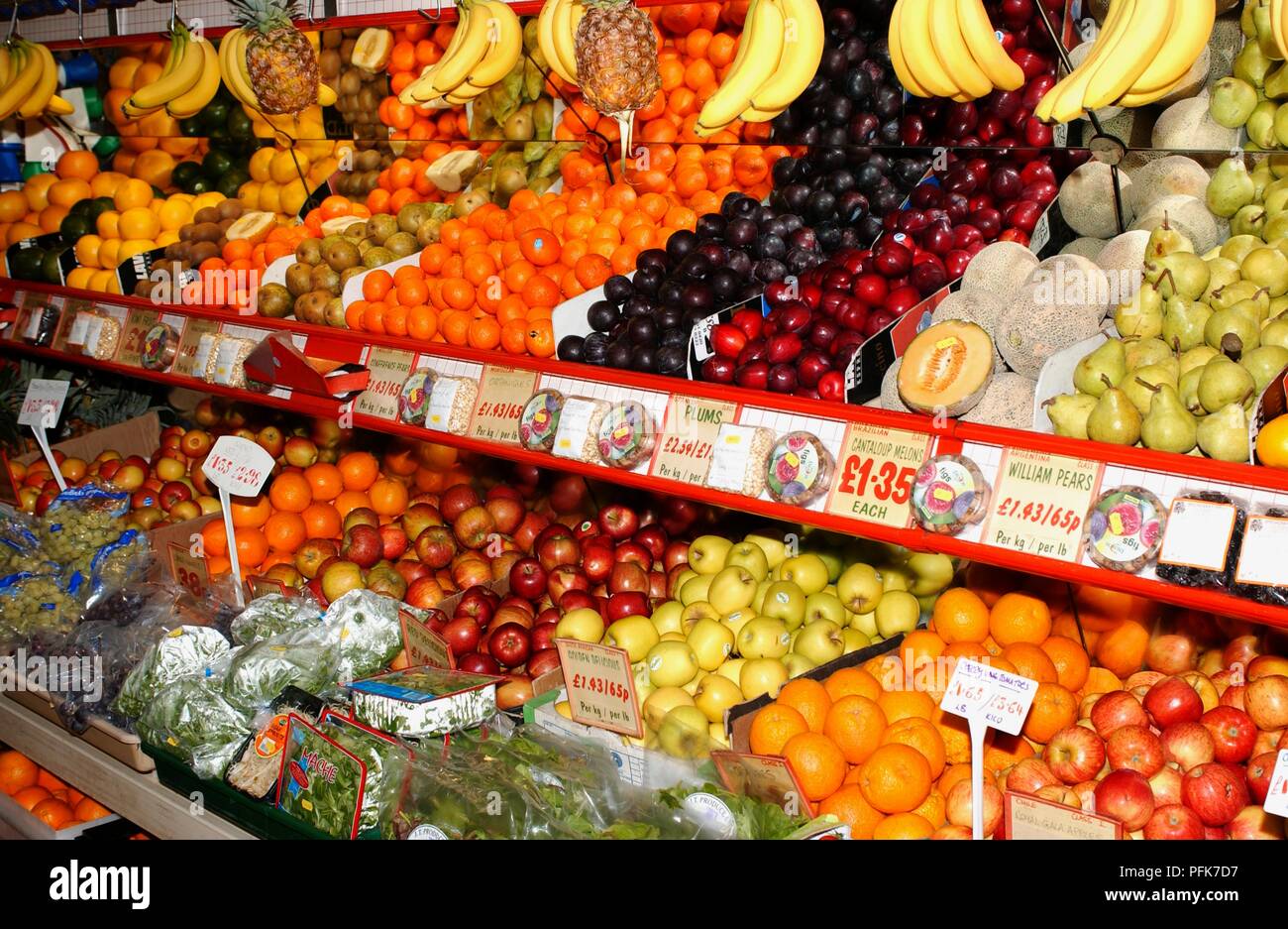 Large selection of fruits and some vegetables arranged on supermarket ...