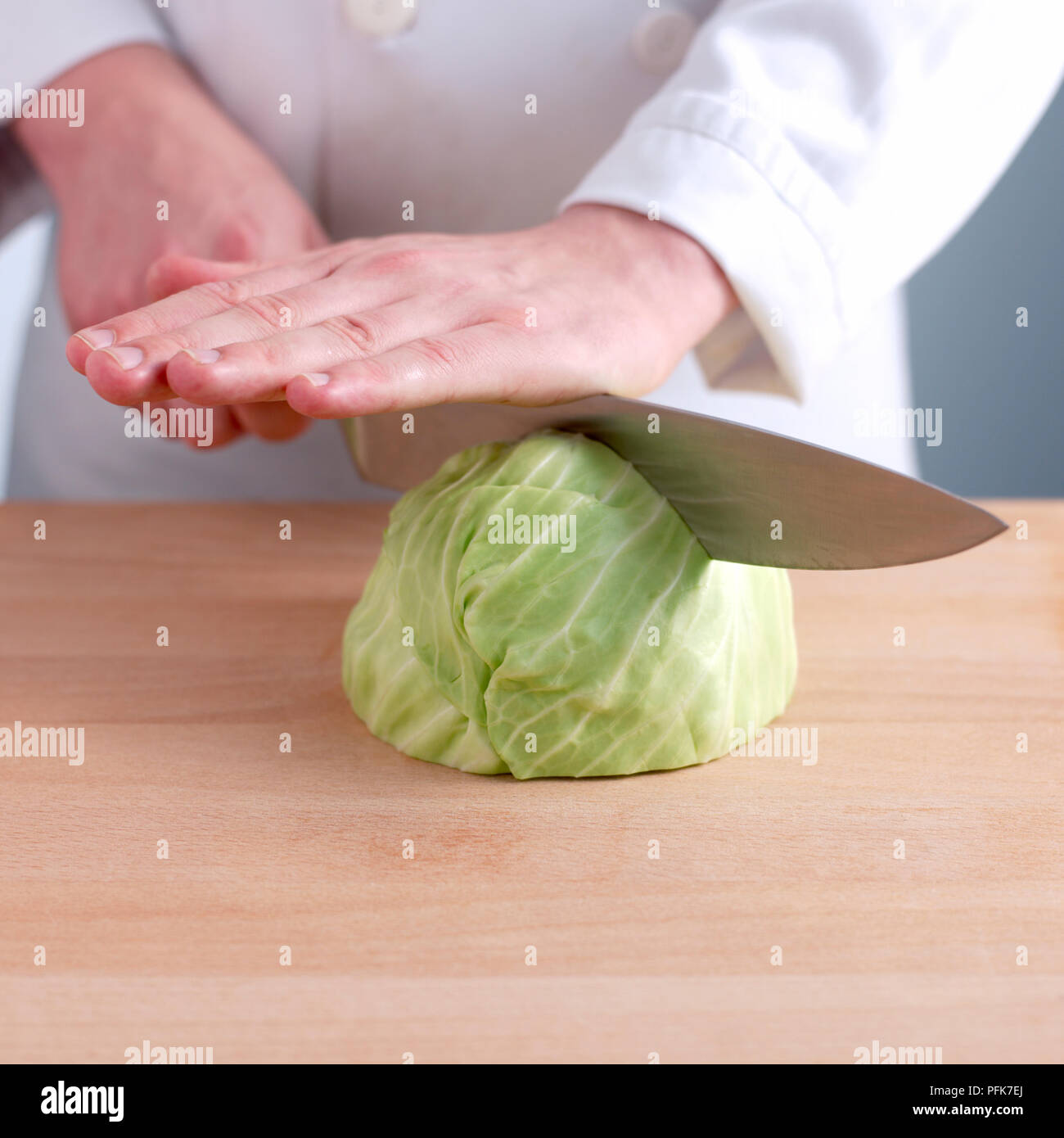 Cutting cabbage with large knife, close-up Stock Photo - Alamy