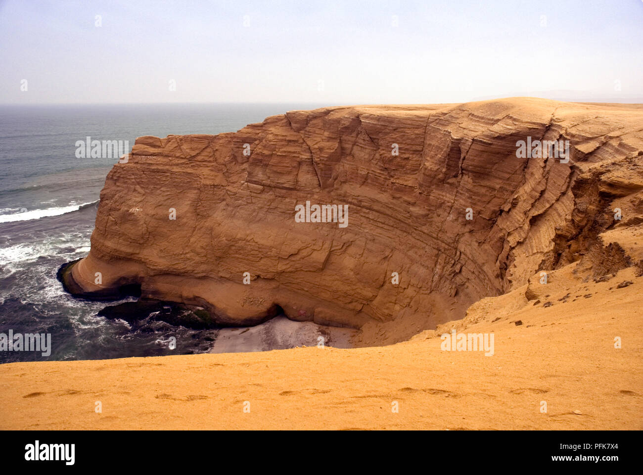 Peru, Ica, Paracas National Reserve, view of siltstone cliffs into sea ...