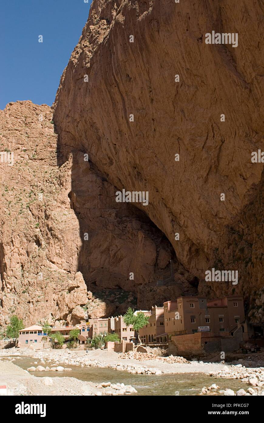 Morocco, High Atlas, Todra Gorge, hotel buildings dwarfed by rocky ...