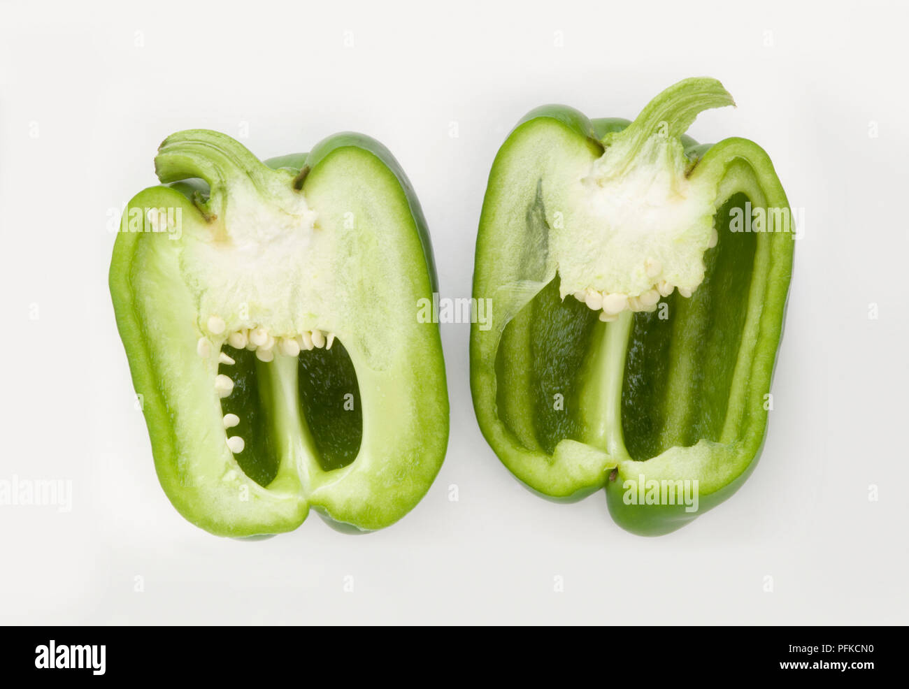Sliced organic Capsicum annuum (Green Bell Peppers) showing flesh and ...