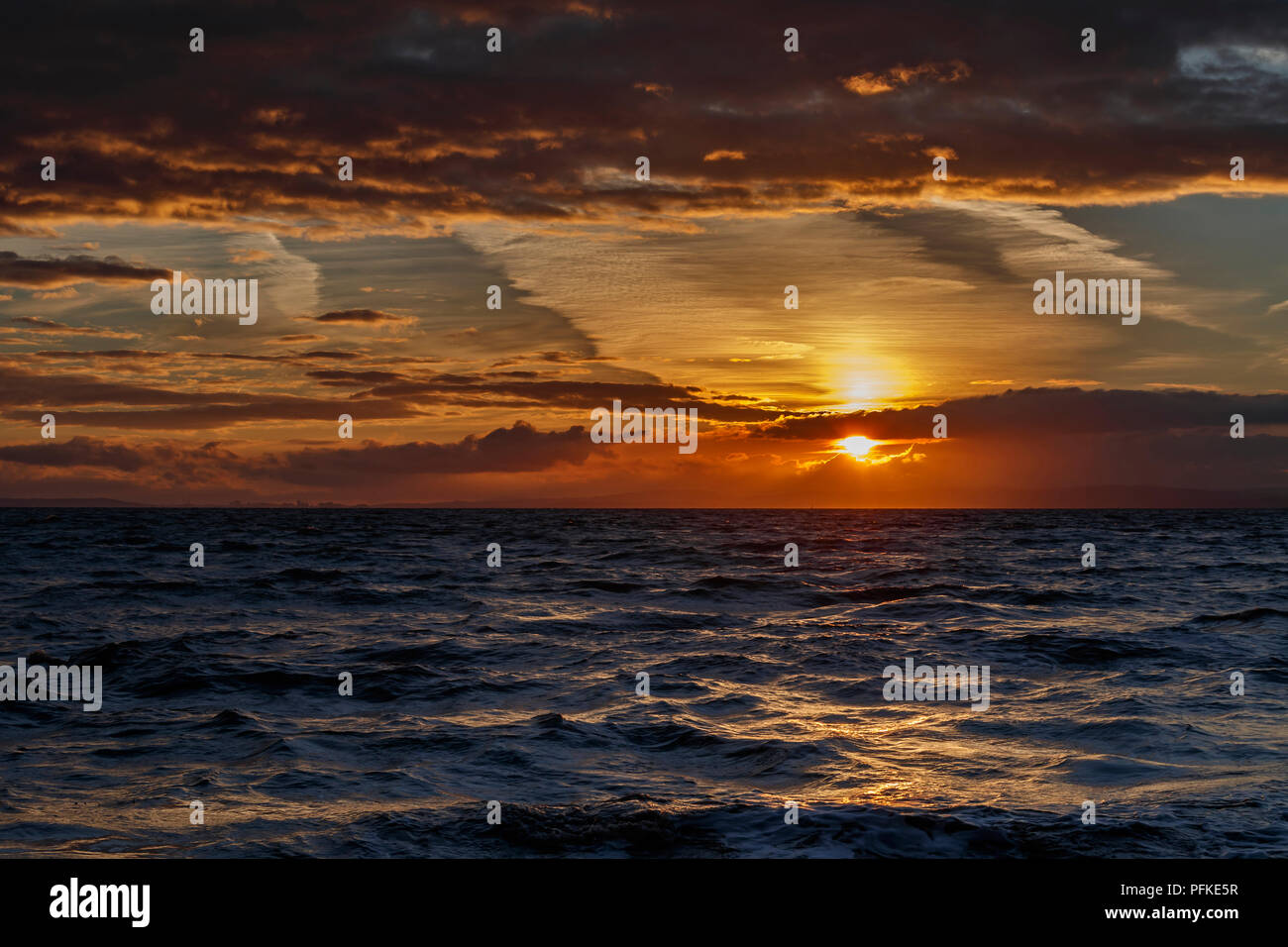 The sun setting Stock Photo - Alamy