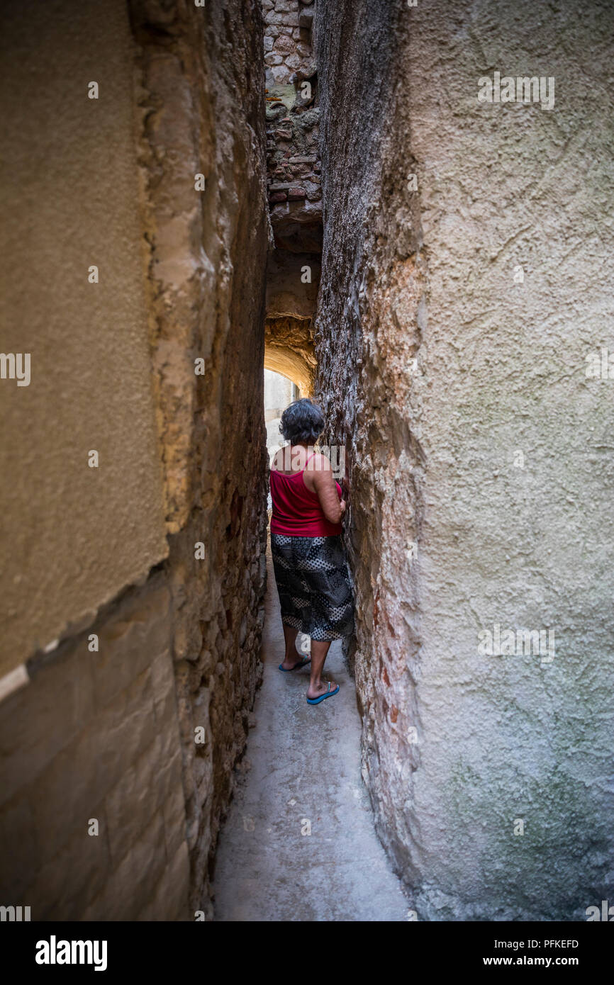 Walking trough narrow street hi-res stock photography and images - Alamy