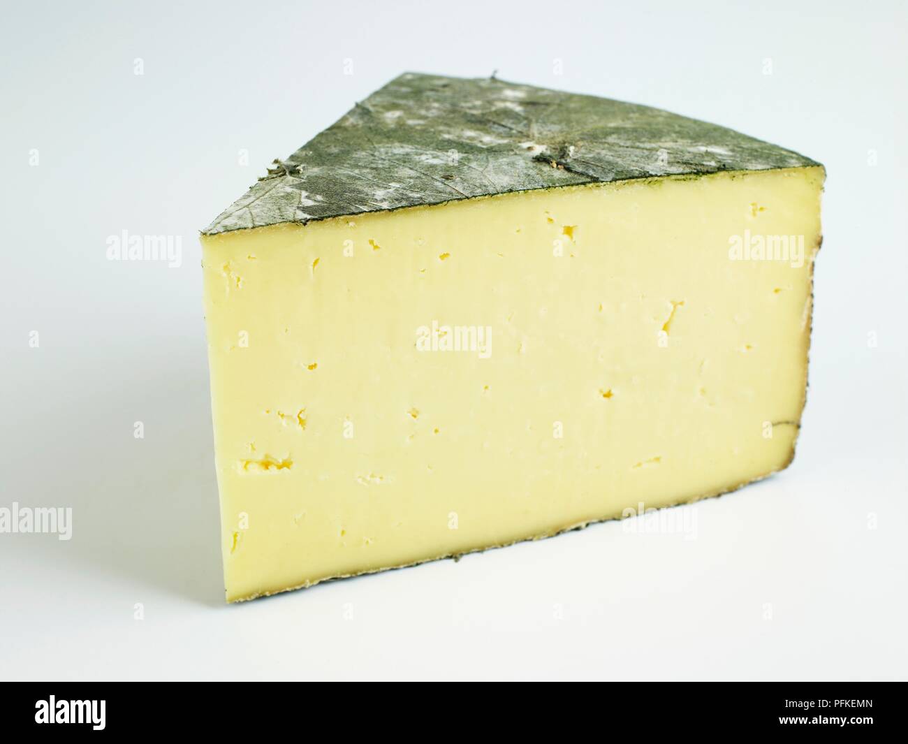 Slice of Cornish Yarg cow's milk cheese Stock Photo - Alamy
