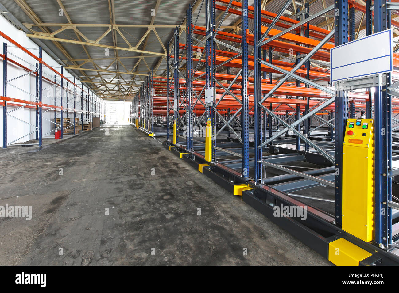 Powered mobile shelving system in distribution warehouse Stock Photo ...