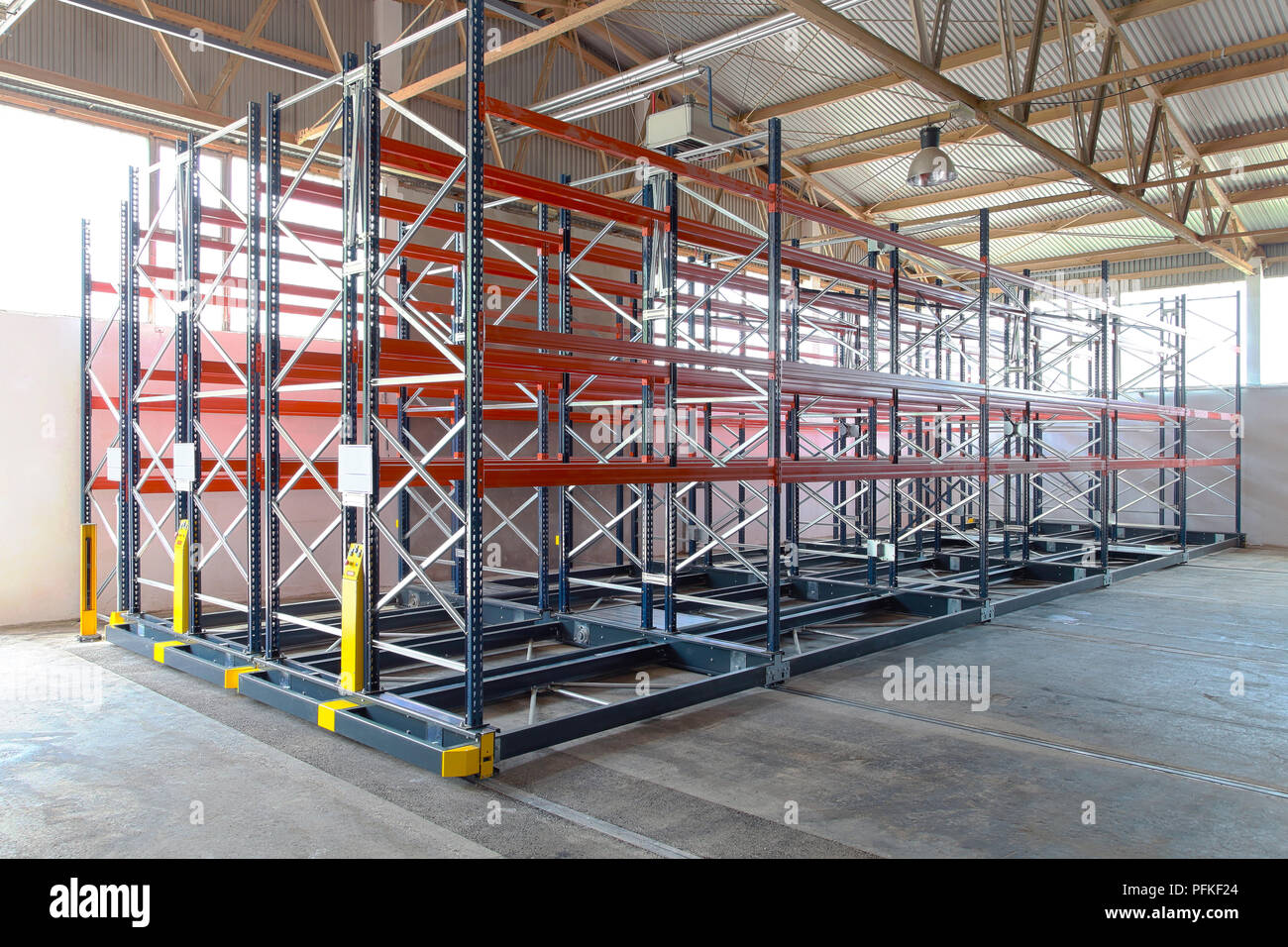 Mobile roller racking system in distribution warehouse Stock Photo - Alamy