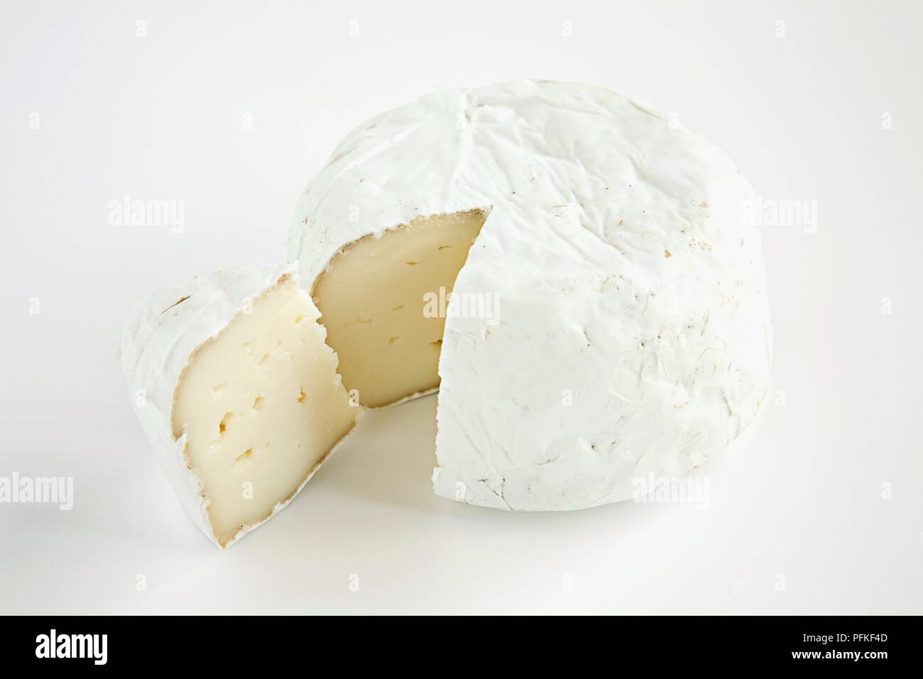 Sliced wheel of American soft Awe Brie cow's milk cheese Stock Photo ...