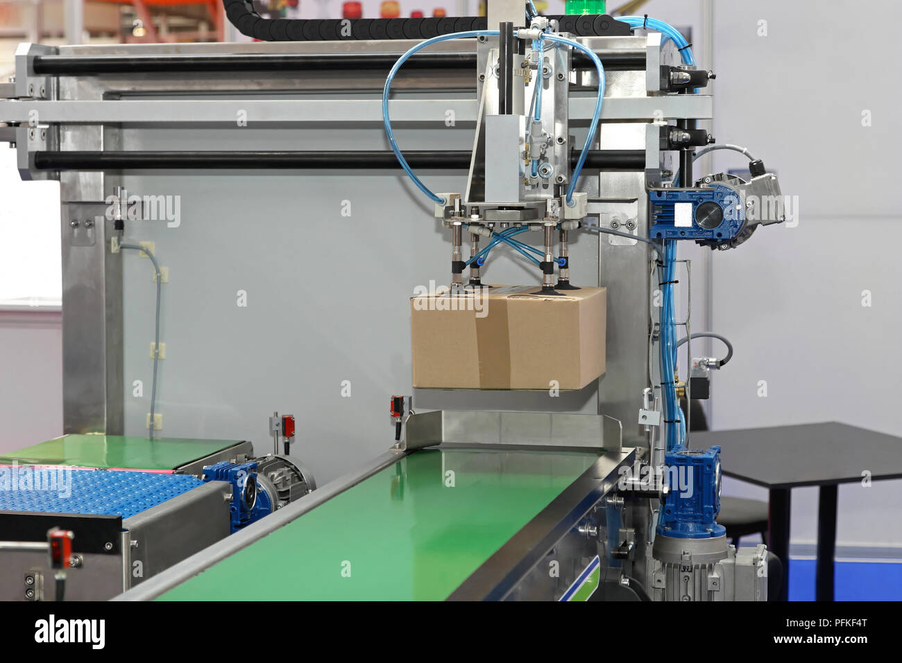 Handling packages at automated line in distribution depot Stock Photo ...