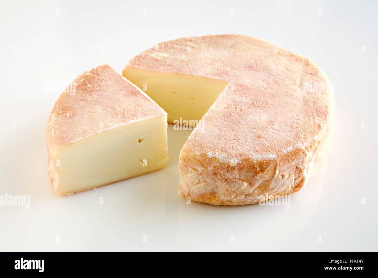 Flat wheel and slice of American Blanca Bianca cow's milk cheese Stock ...