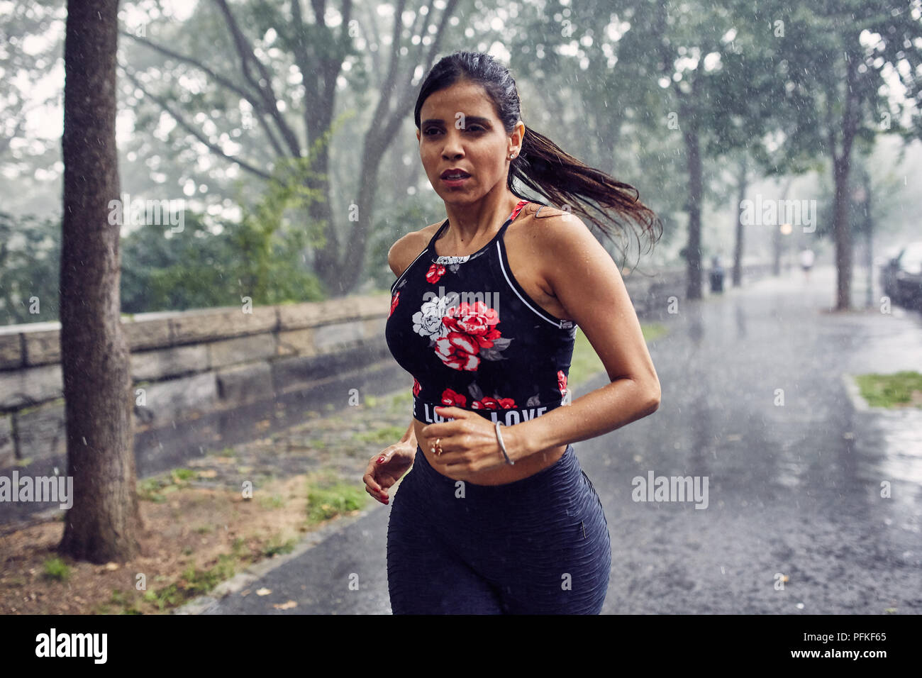 Woman Running In Rain