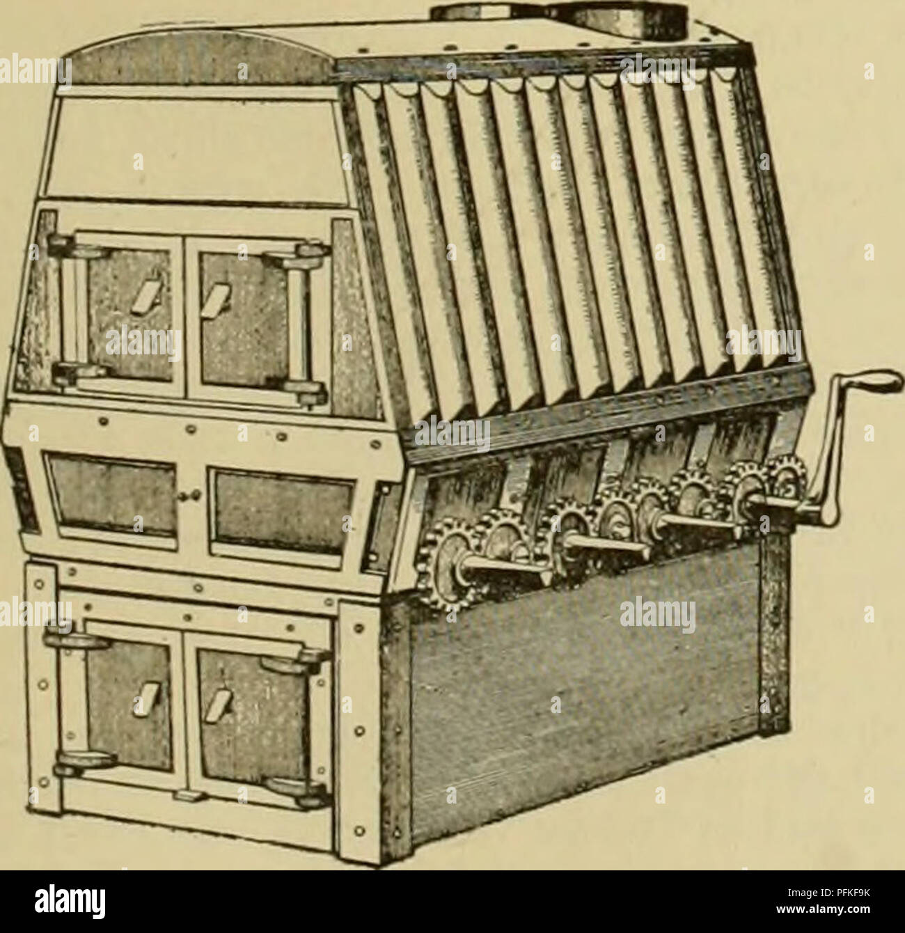 This image depicts a fruit drier placed on a standard kitchen stove ...