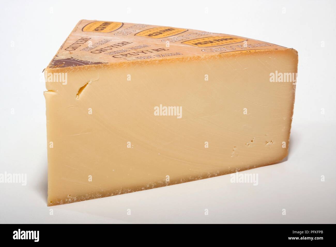 Slice of Australian Heidi Farm Gruyere cow's milk cheese Stock Photo ...