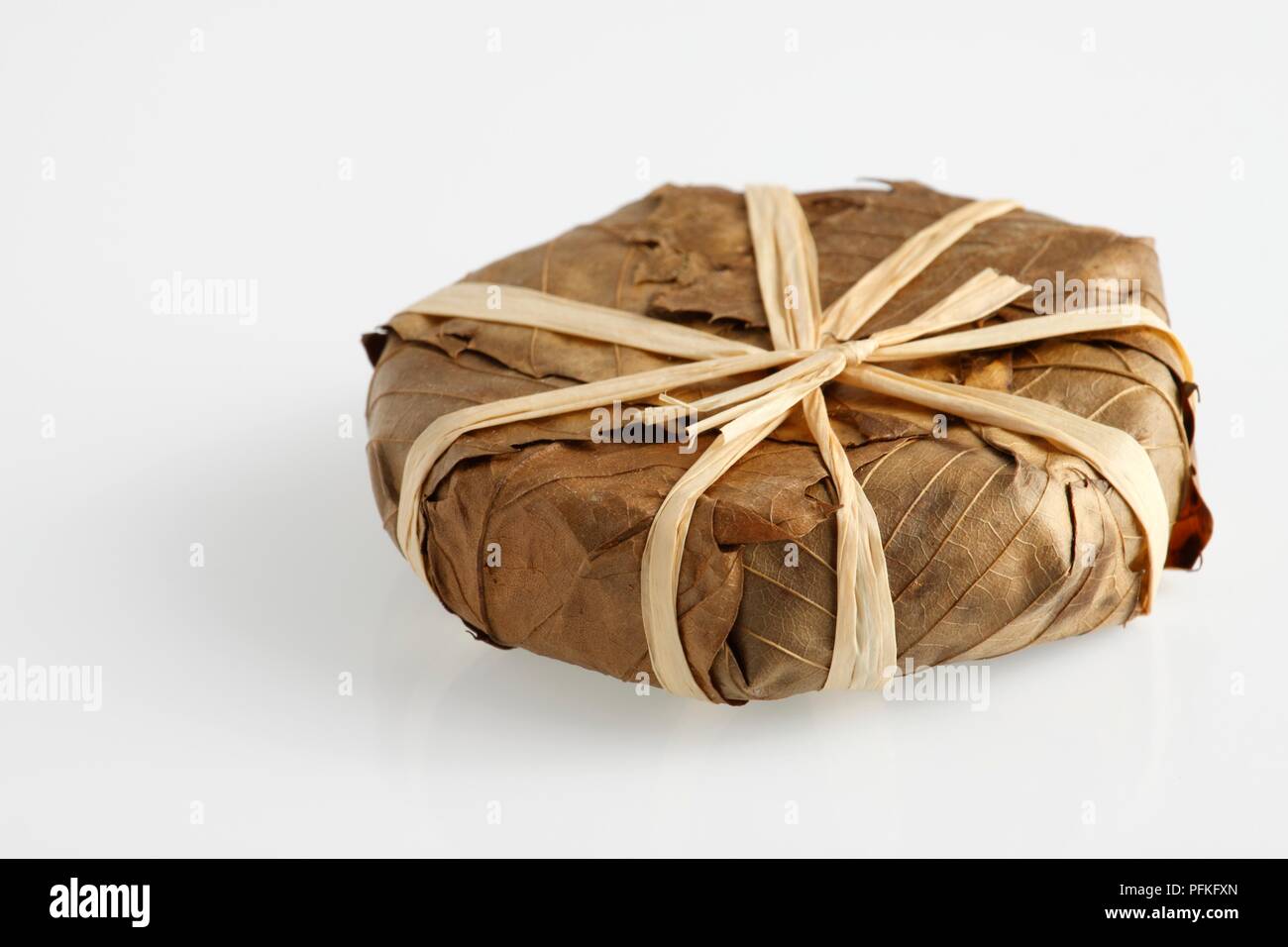 French Banon AOC goat's cheese wrapped chestnut leaves tied with raffia ...