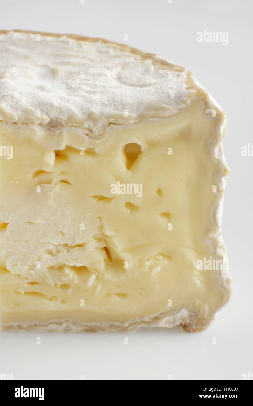 Slice of French Chaource AOC cow's milk cheese, close-up Stock Photo ...