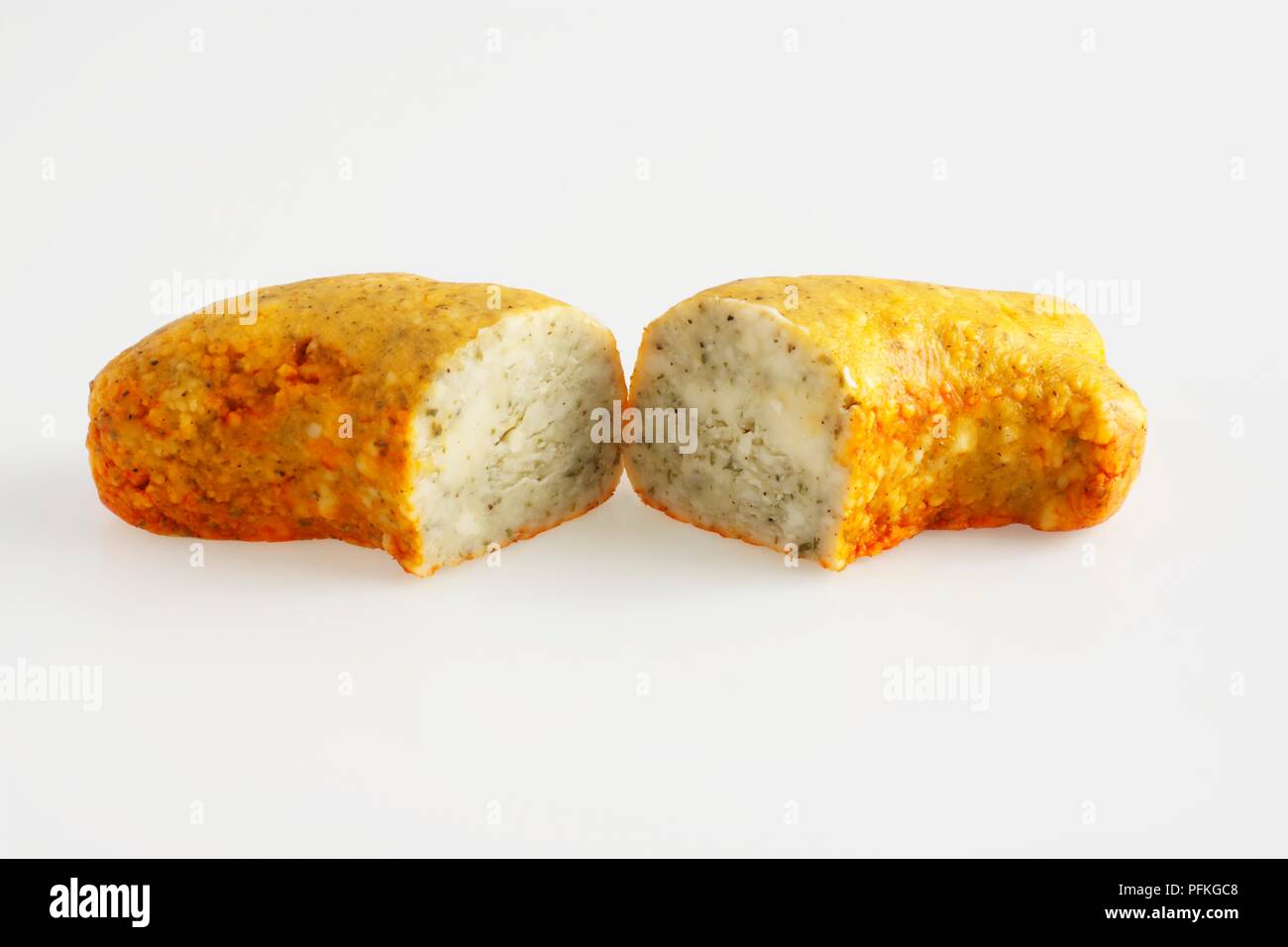 Sliced French Dauphin cow's milk cheese showing washed red rind Stock ...