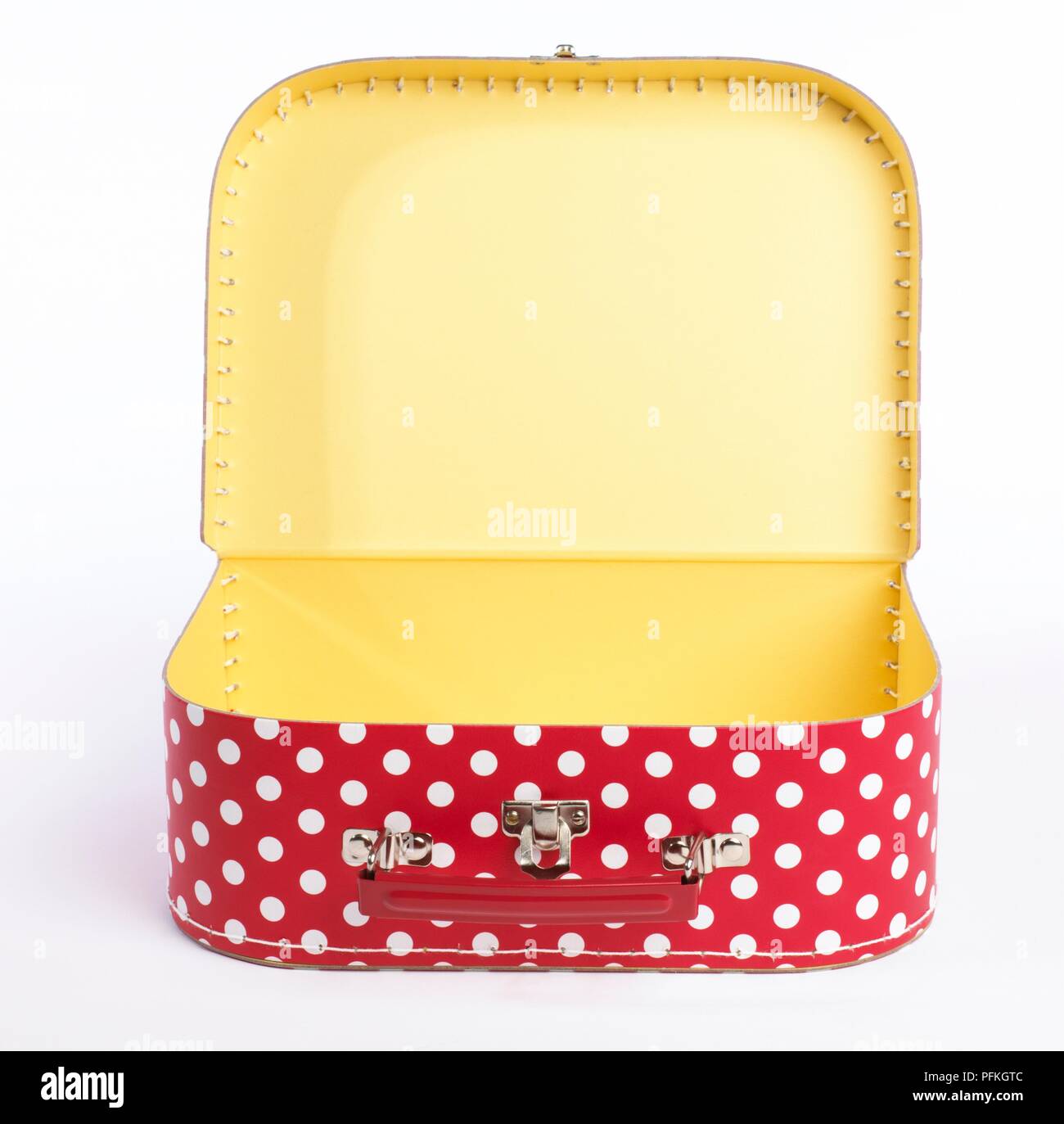 Red and white-spotted suitcase, open Stock Photo - Alamy