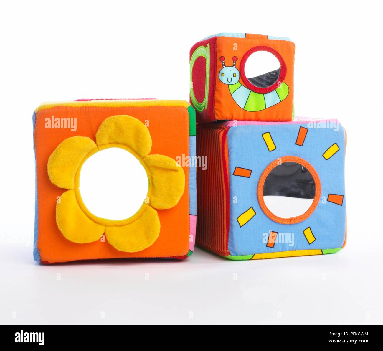Three toy cubes with different patterns and mirrors on them Stock Photo ...