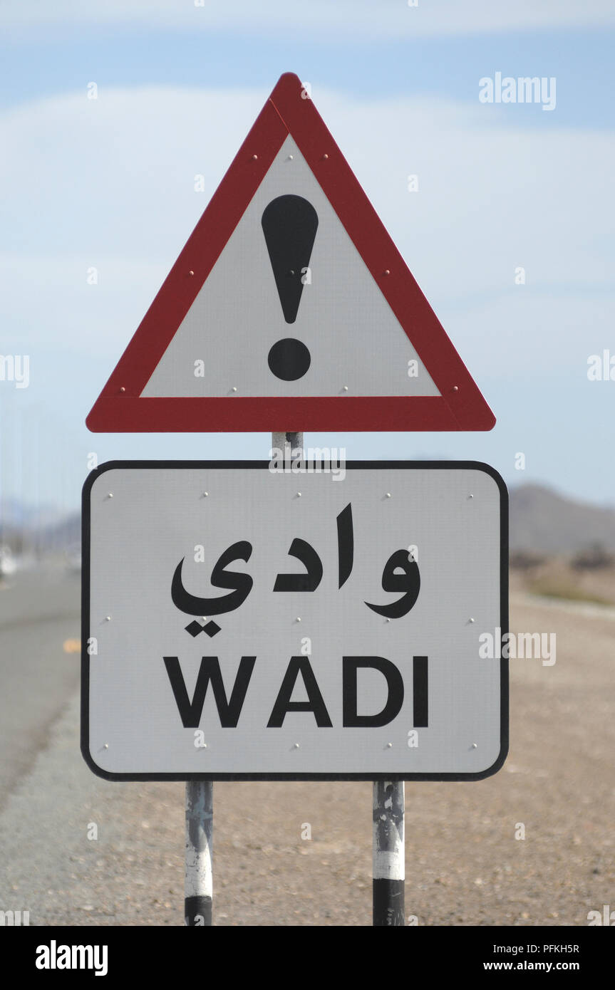 United Arab Emirates, Wadi caution sign in western and Arabic script ...