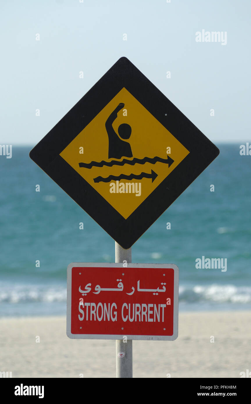 United Arab Emirates, Dubai, sign in western and Arabic script warning ...