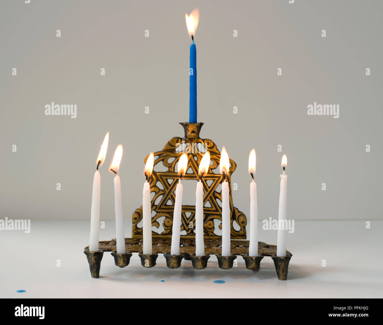 Traditional Jewish candle holder with nine lit candles, close-up Stock ...