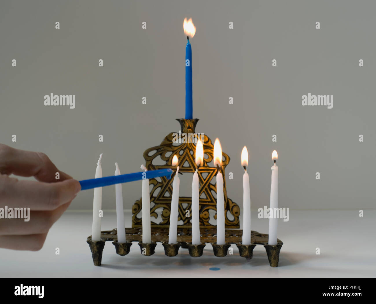 Lighting candles on traditional Jewish candle holder, close-up Stock ...