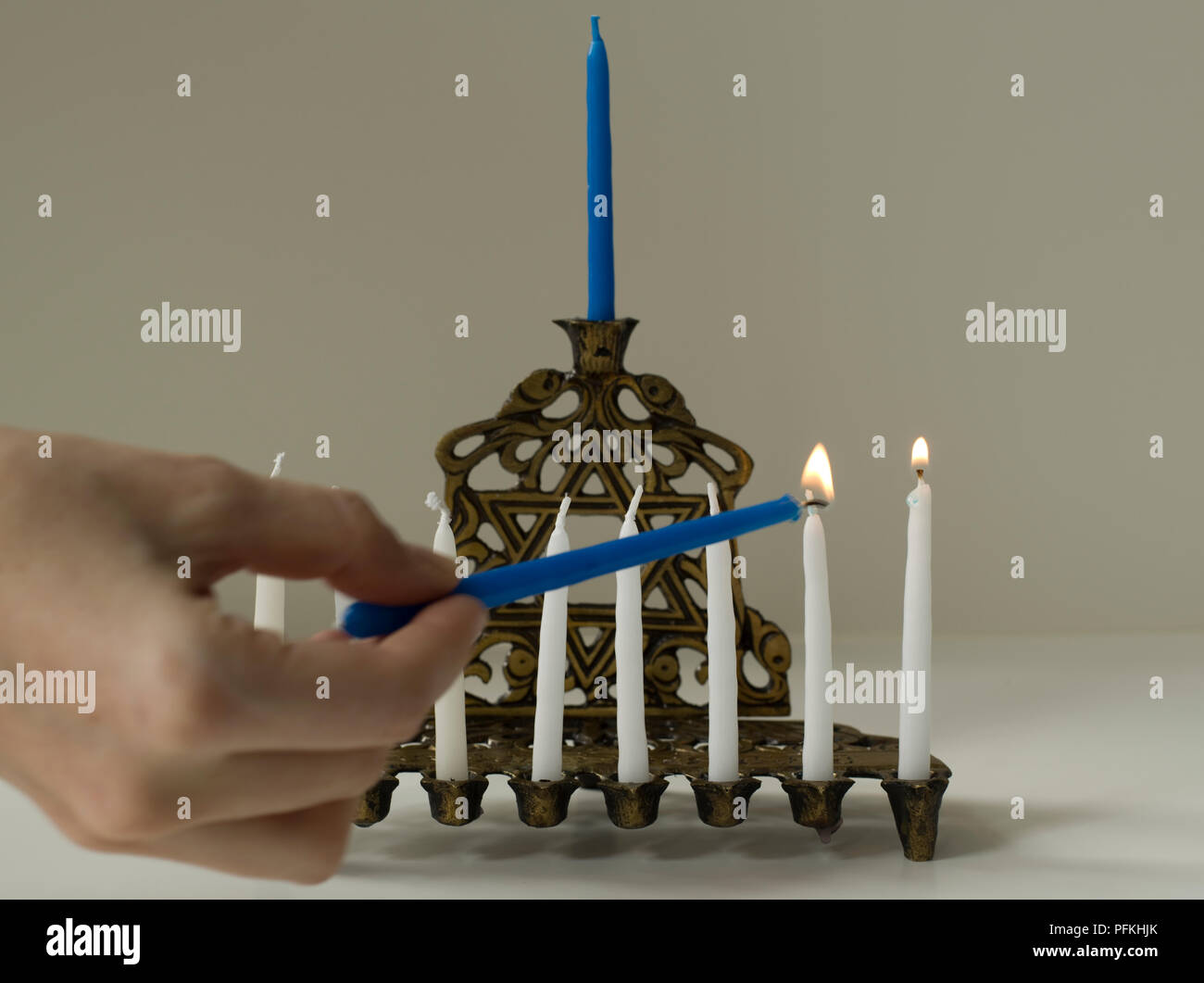 Human hand lighting candles hi-res stock photography and images - Alamy