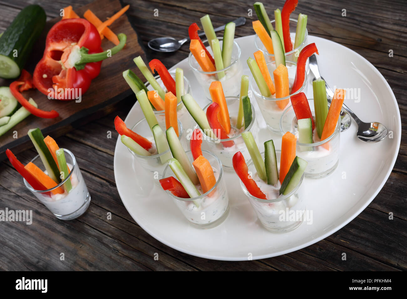 individual Cocktail shot glasses with tartar spicy sauce and colorful ...