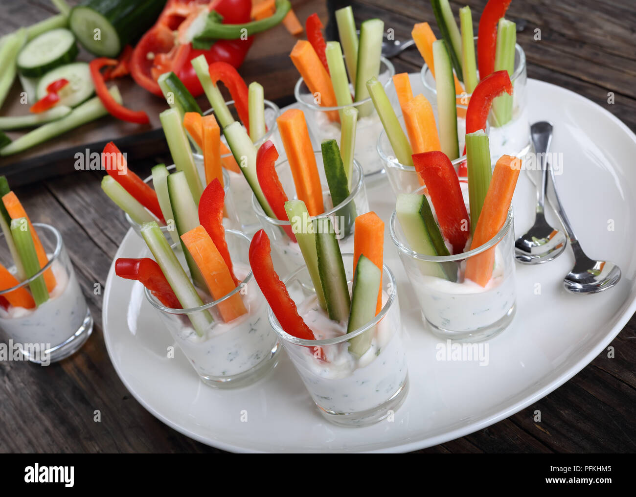 individual Cocktail shot glasses with tartar spicy sauce and colorful ...