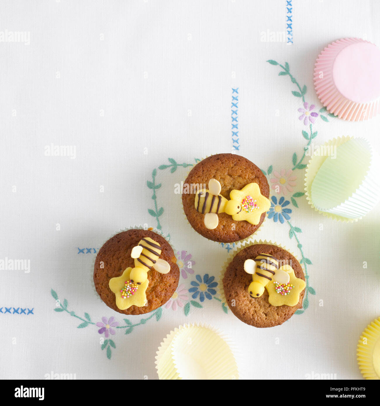 Honey cakes decorated with marzipan bees and flowers, view from above ...