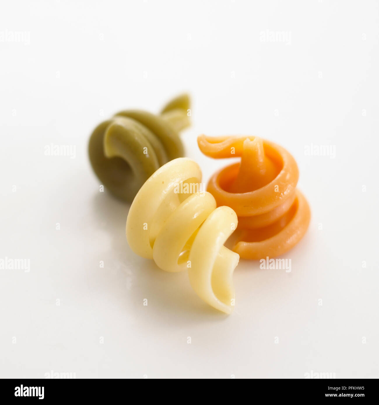 Spiral shaped pasta, plain, tomato flavoured and spinach flavoured ...